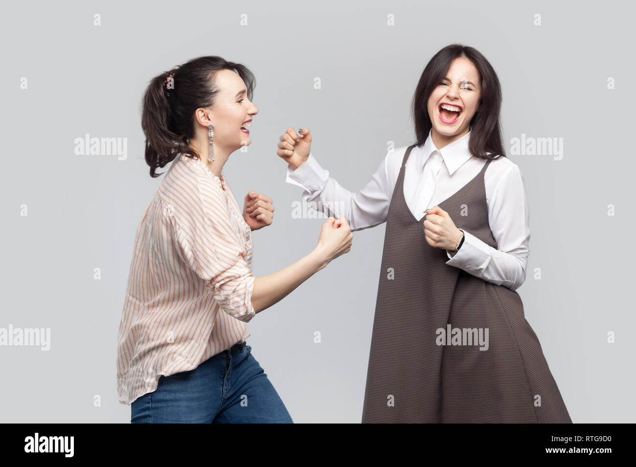 Female friends shouting standing hi-res stock photography and images ...