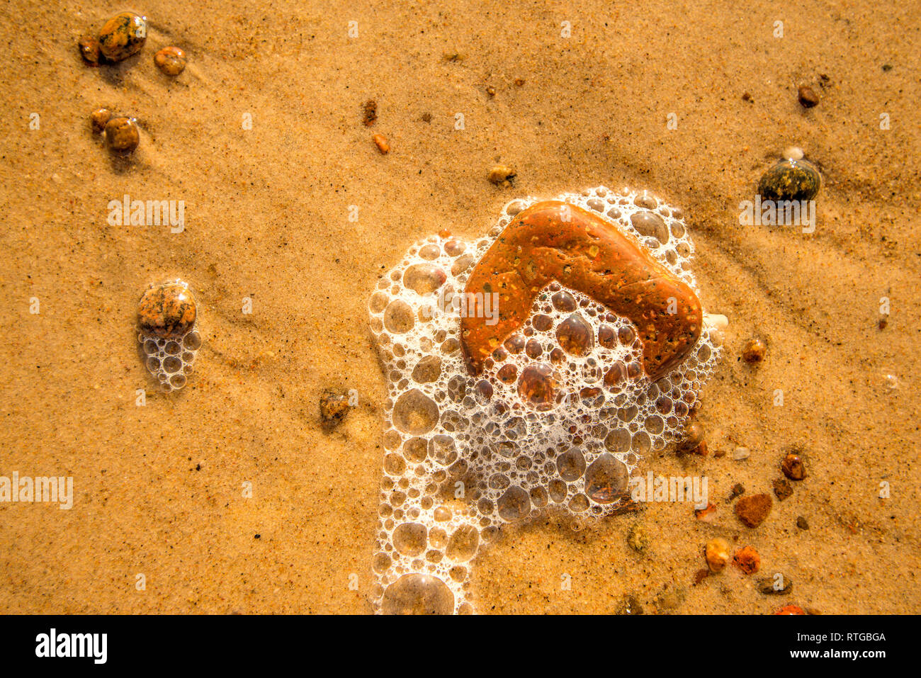 pebbles and spray of the surf Stock Photo - Alamy