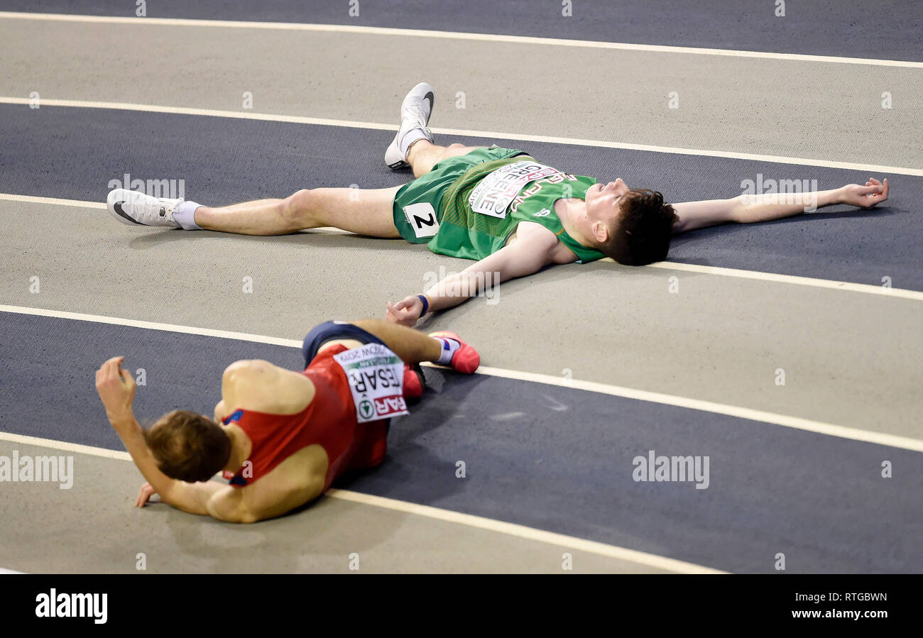 Czech Republic's Jan Tesar and Ireland's Cillin Greene lie on the track ...