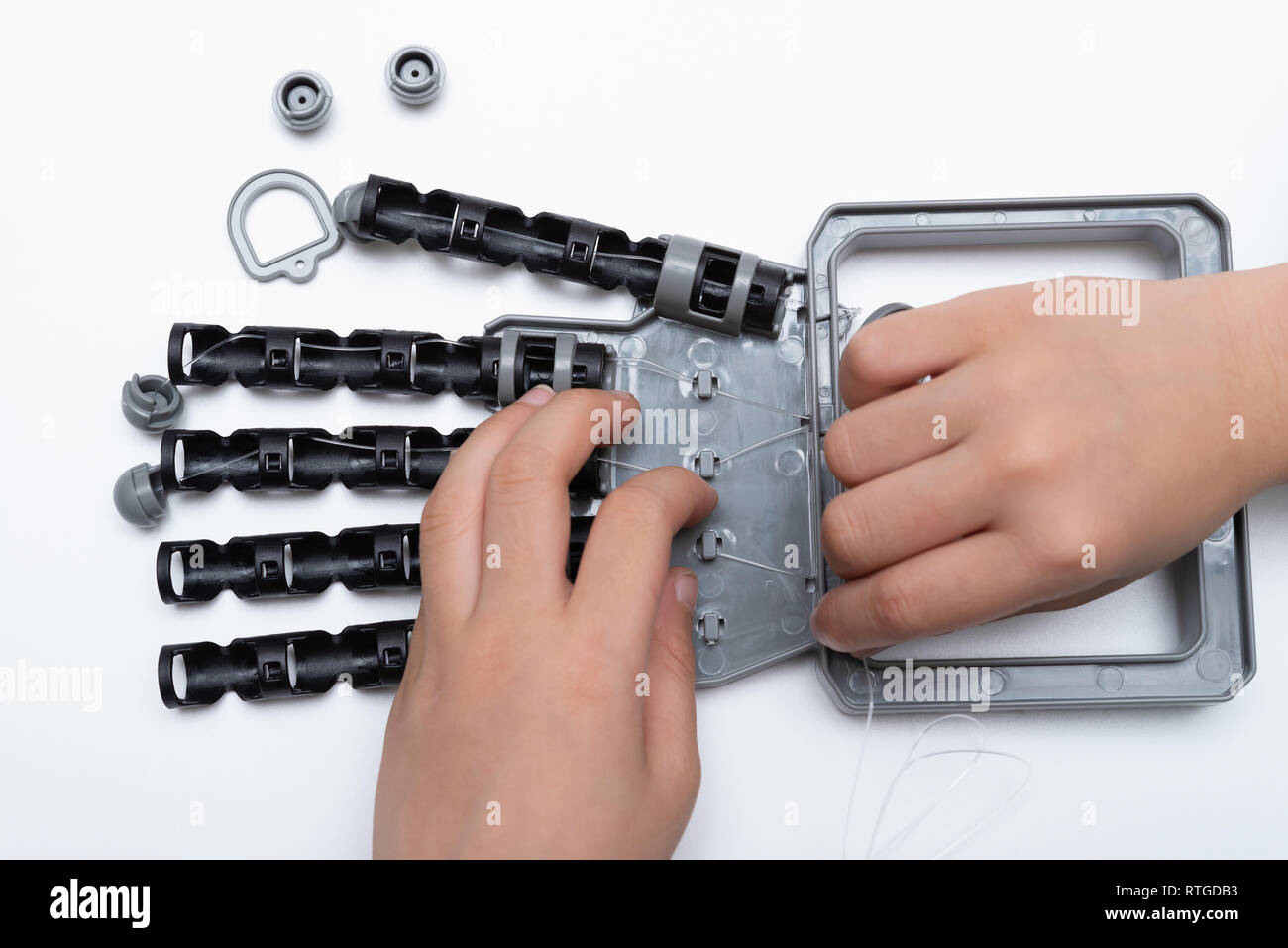 kid assembling a robot hand Stock Photo - Alamy