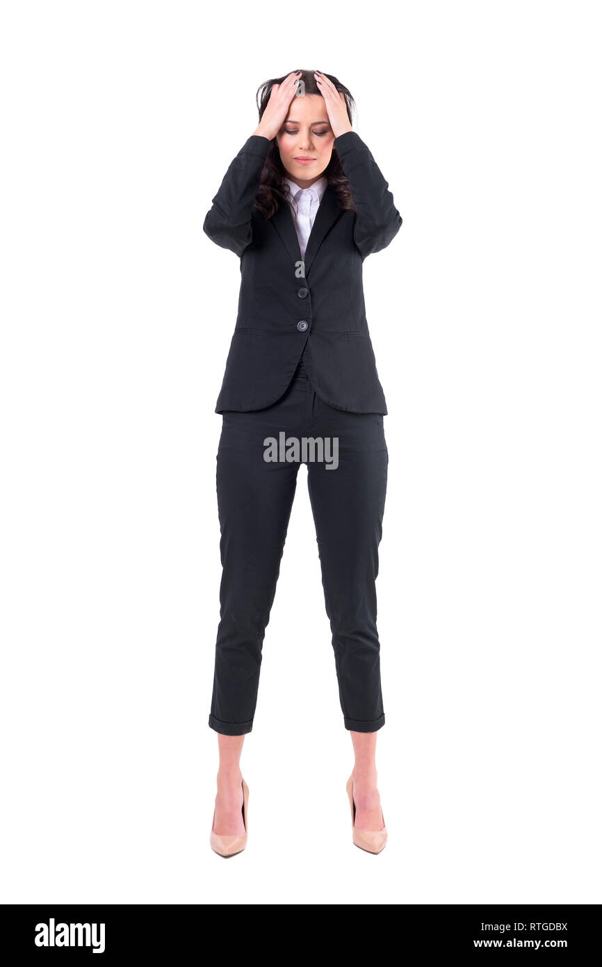 Stressed overworked young business woman having headache with head in ...