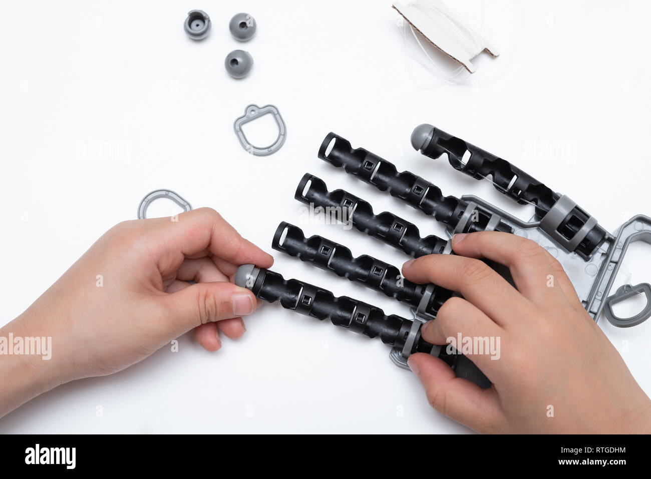 kid assembling a robot hand Stock Photo - Alamy