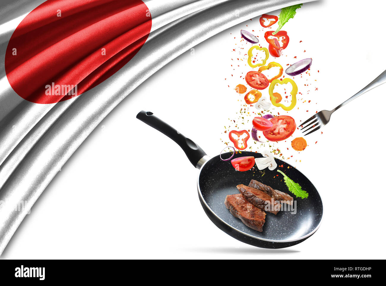 Frying pan with falling vegetables and meat, isolated. On the ...