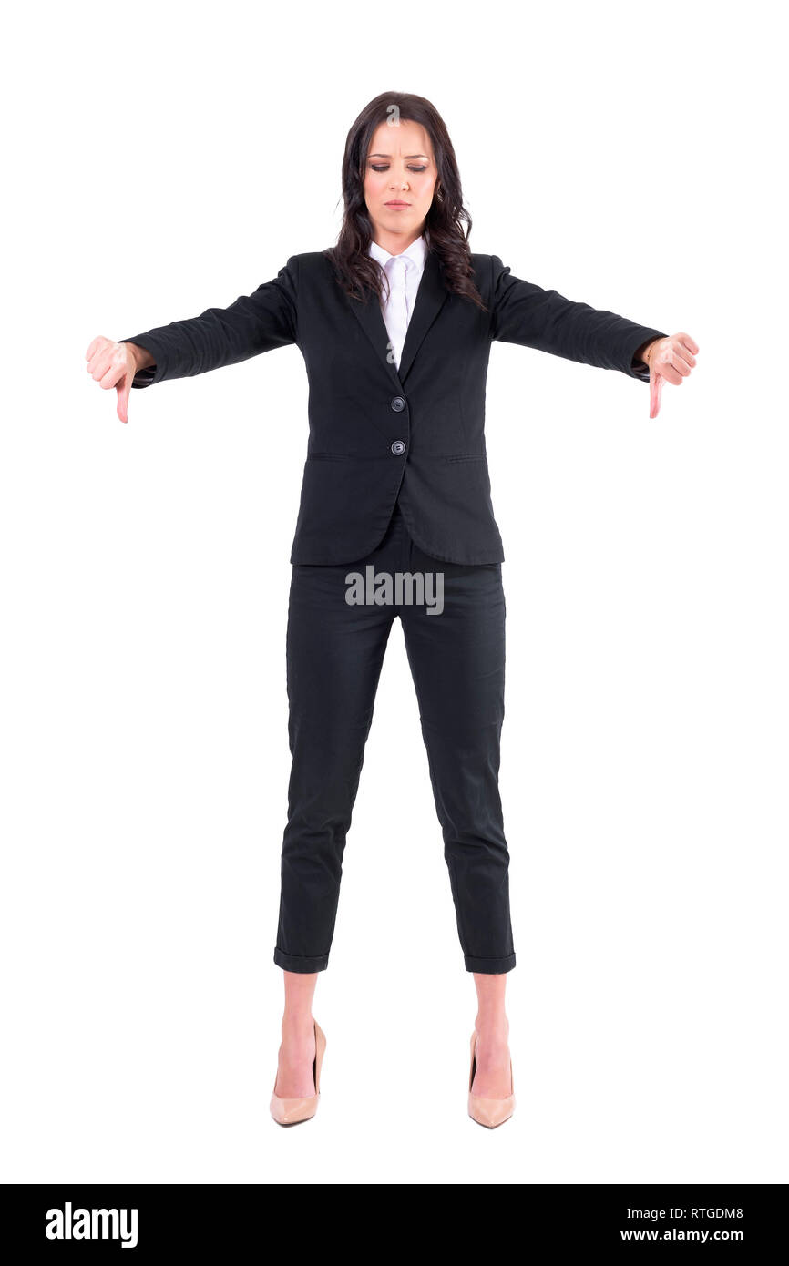Sad upset business woman with thumbs down gesture looking down. Full ...
