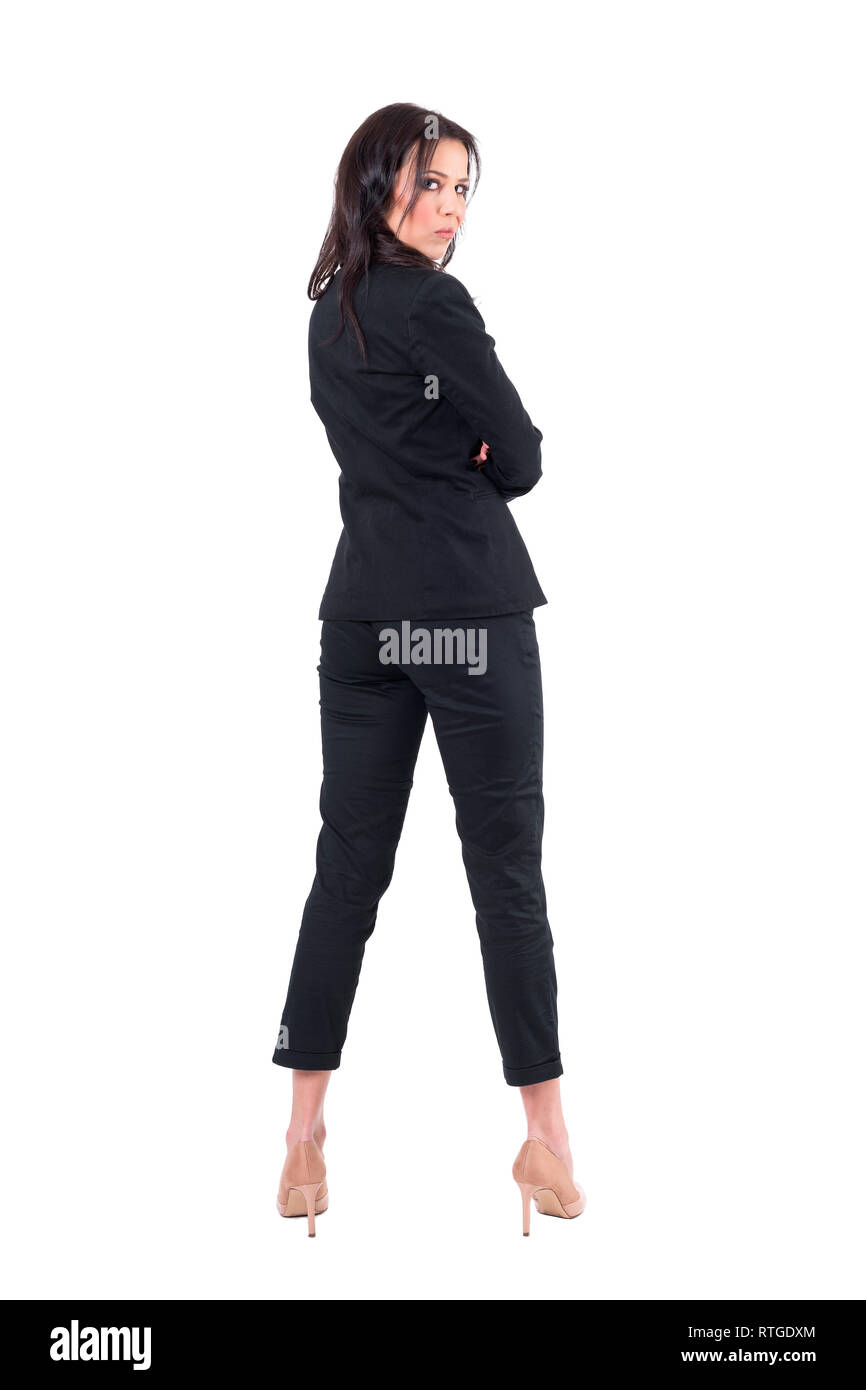 Rear view of angry business woman in audience at presentation disrupted ...