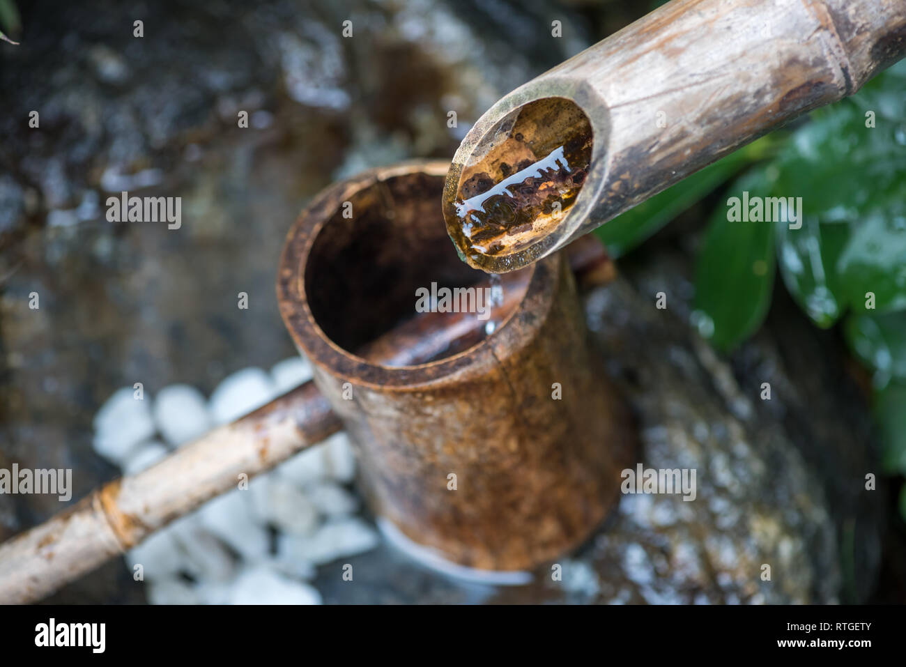 Natural wooden gutter tree fountain close-up view in Chengdu, Sichuan ...