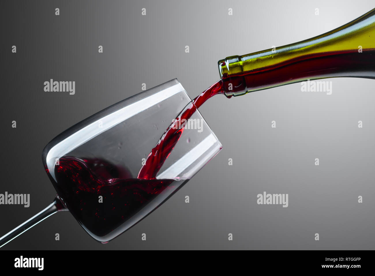 Red wine being poured into glass on a grey background. Saved clipping ...