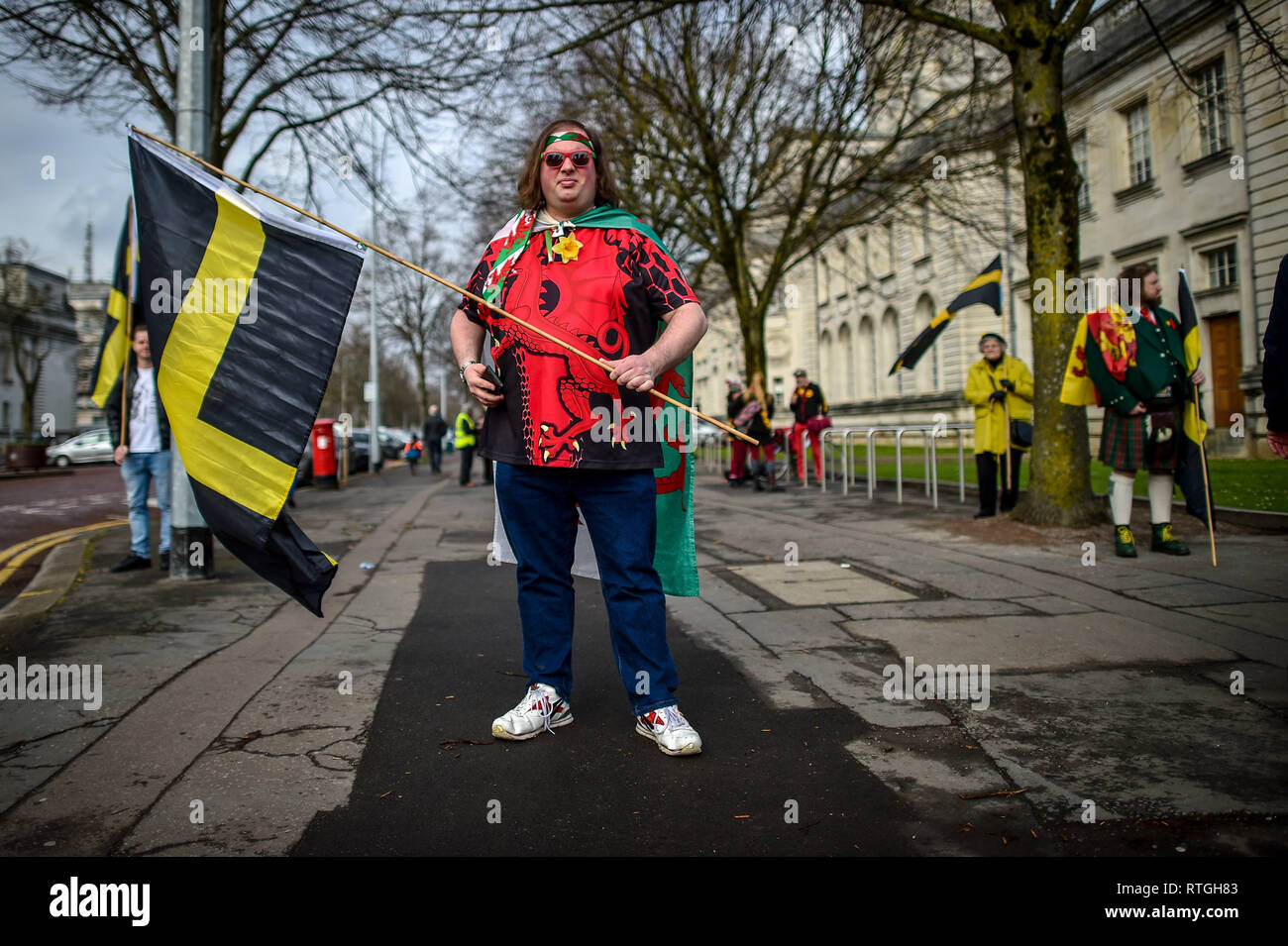 Llewellyn Smith, from Newport, wears Welsh themed items and holds the ...