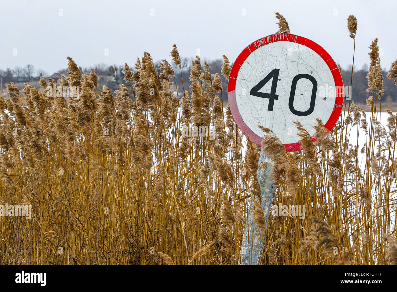 Old speed limit traffic sign on the side of the road Stock Photo - Alamy