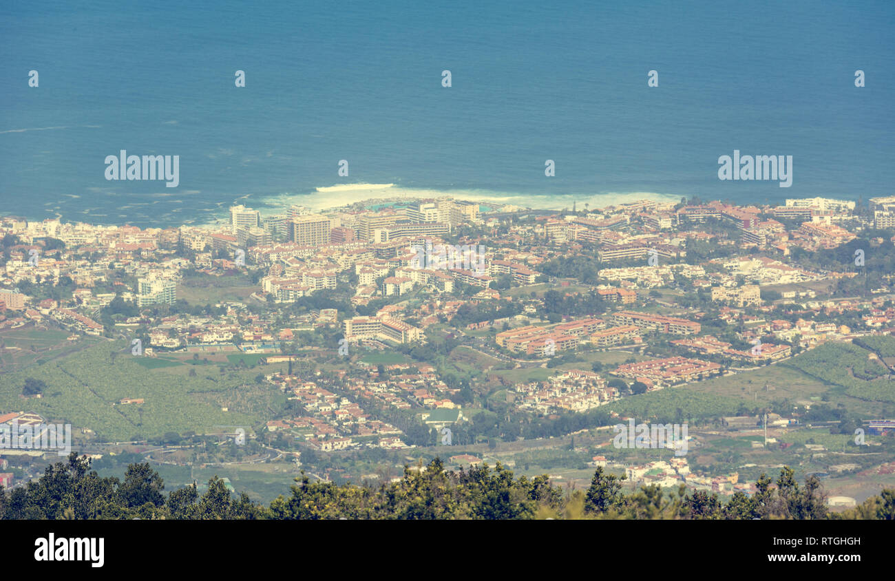 Landscape view of coastal city from far away Stock Photo - Alamy