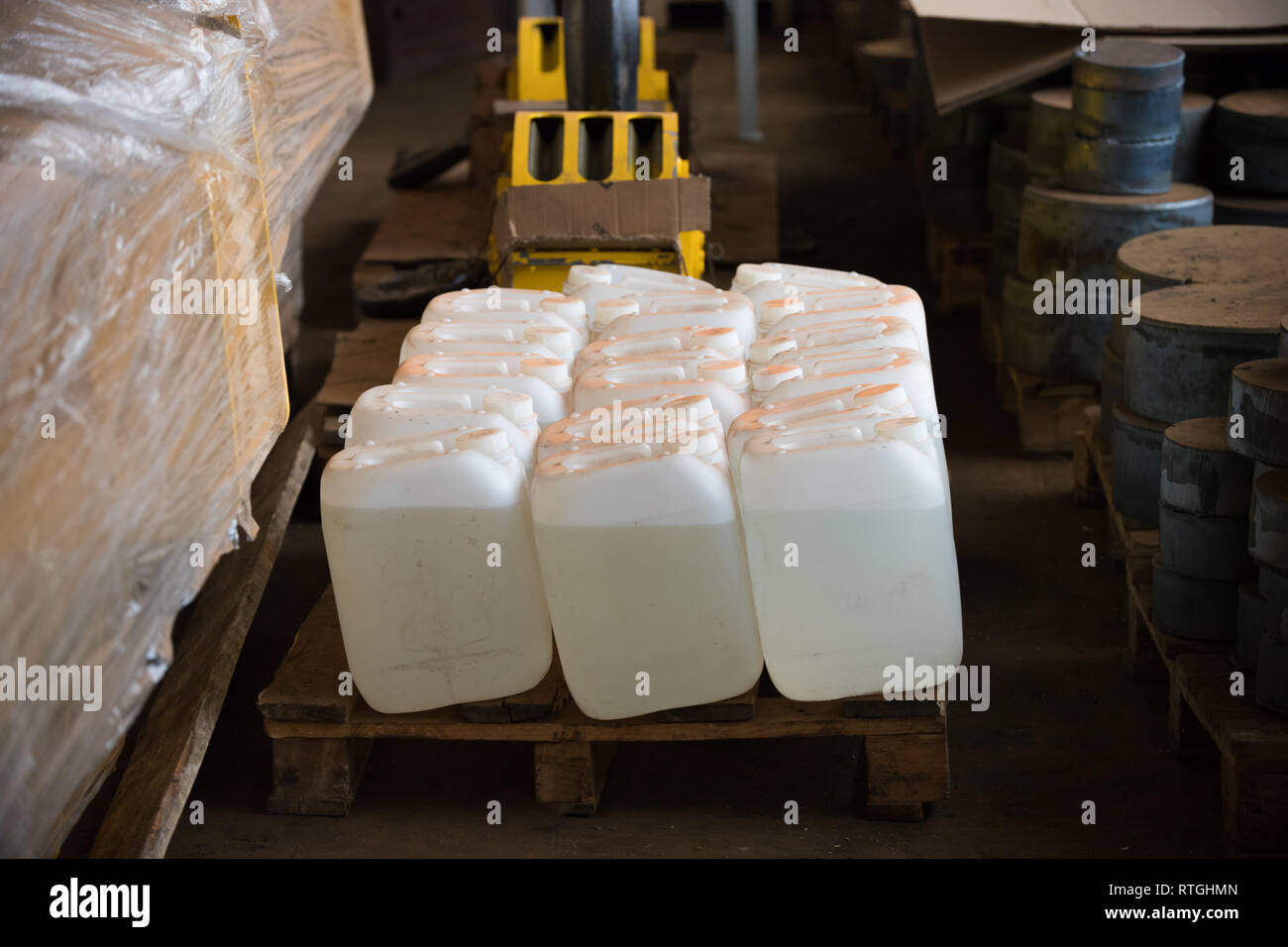 Industrial concept. Canisters filled with liquid on the stand Stock ...