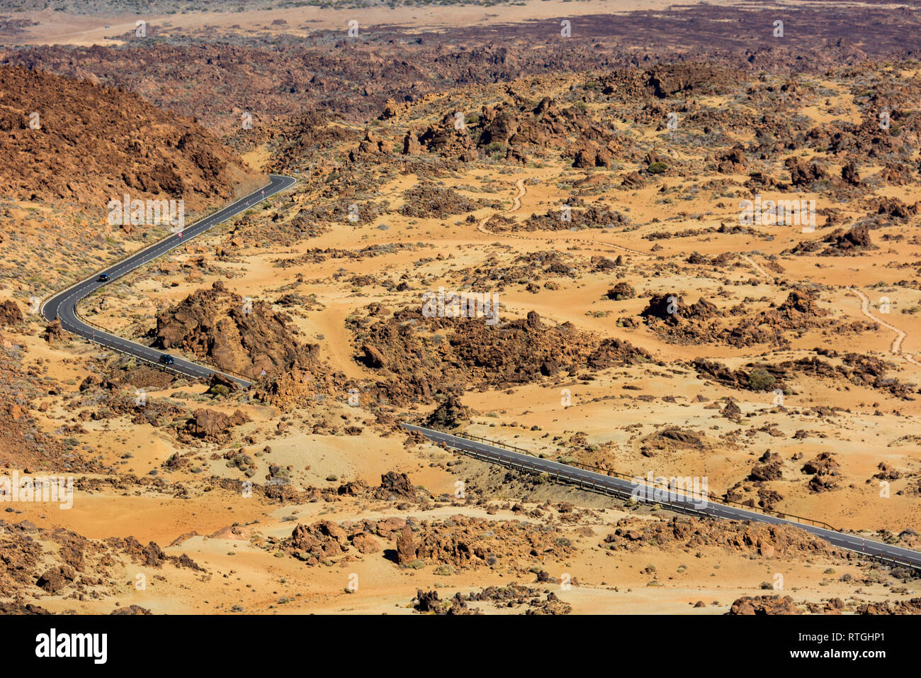 Road crossing spectacular lava shapped landscape in volcanic crater ...