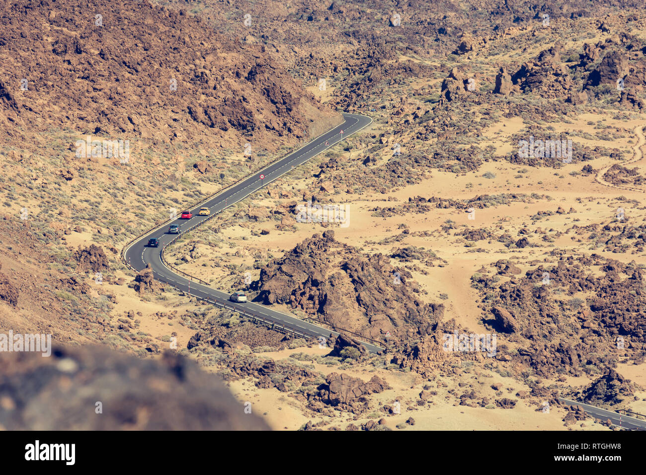 Road crossing spectacular lava shapped landscape in volcanic crater ...