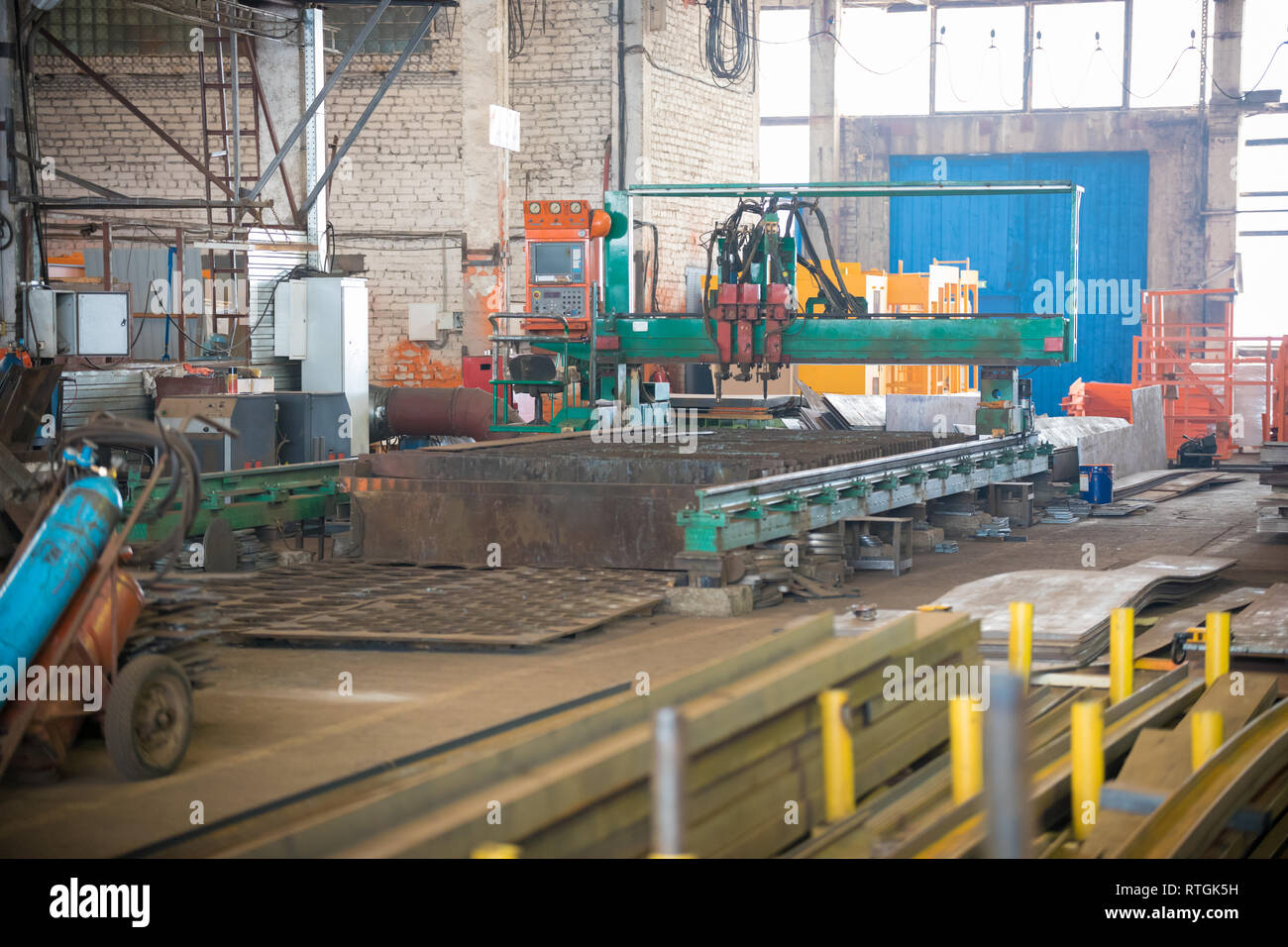 Industrial concept. Constructing site indoors. Assembly line . Mid shot ...
