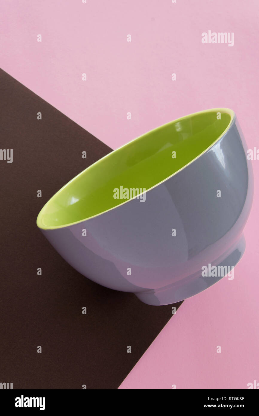 Overhead flat lay view of clean ceramic tableware on colorful ...