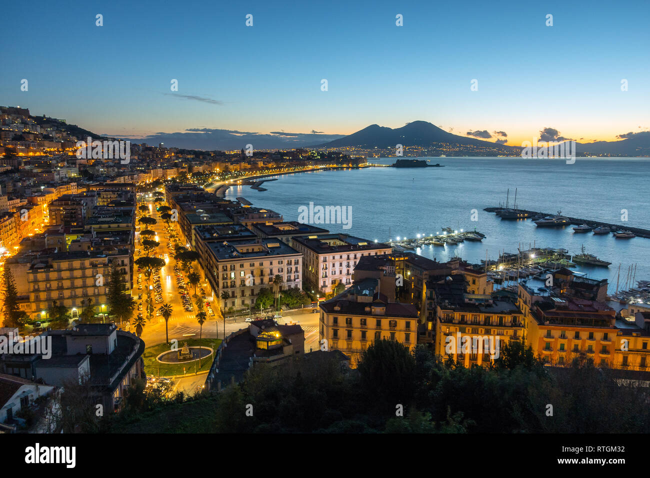 Naples, Italy. Evening city car traffic and the sea bay Stock Photo - Alamy