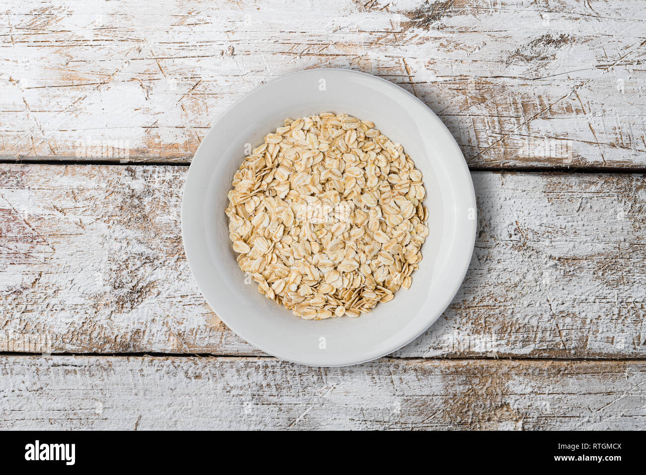 white plate with oat braids on white background Stock Photo - Alamy