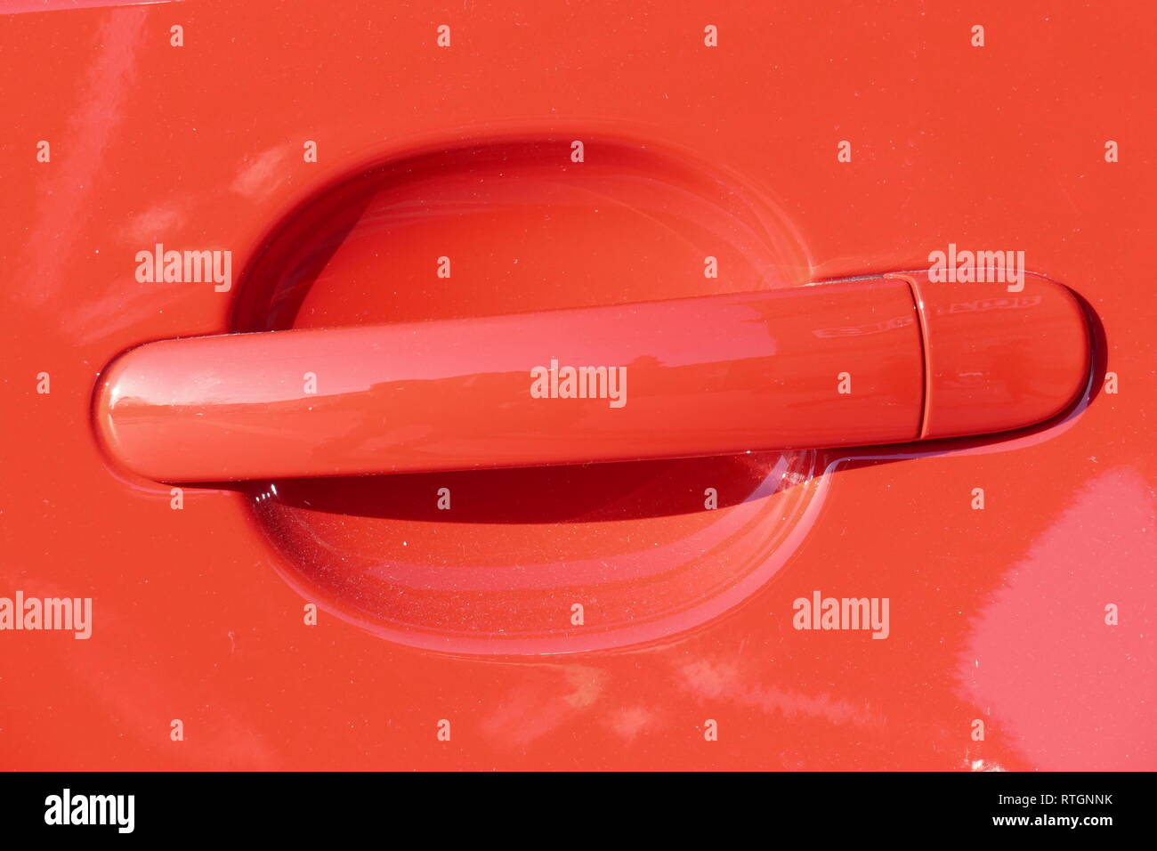 Red door lock on a red car Stock Photo - Alamy