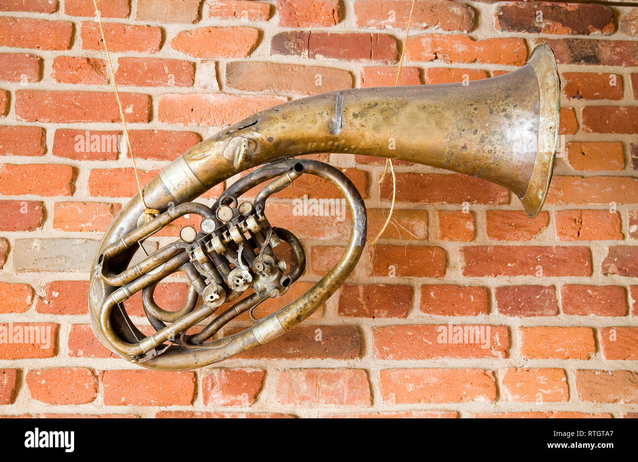 old music instrument on the brick wall Stock Photo - Alamy