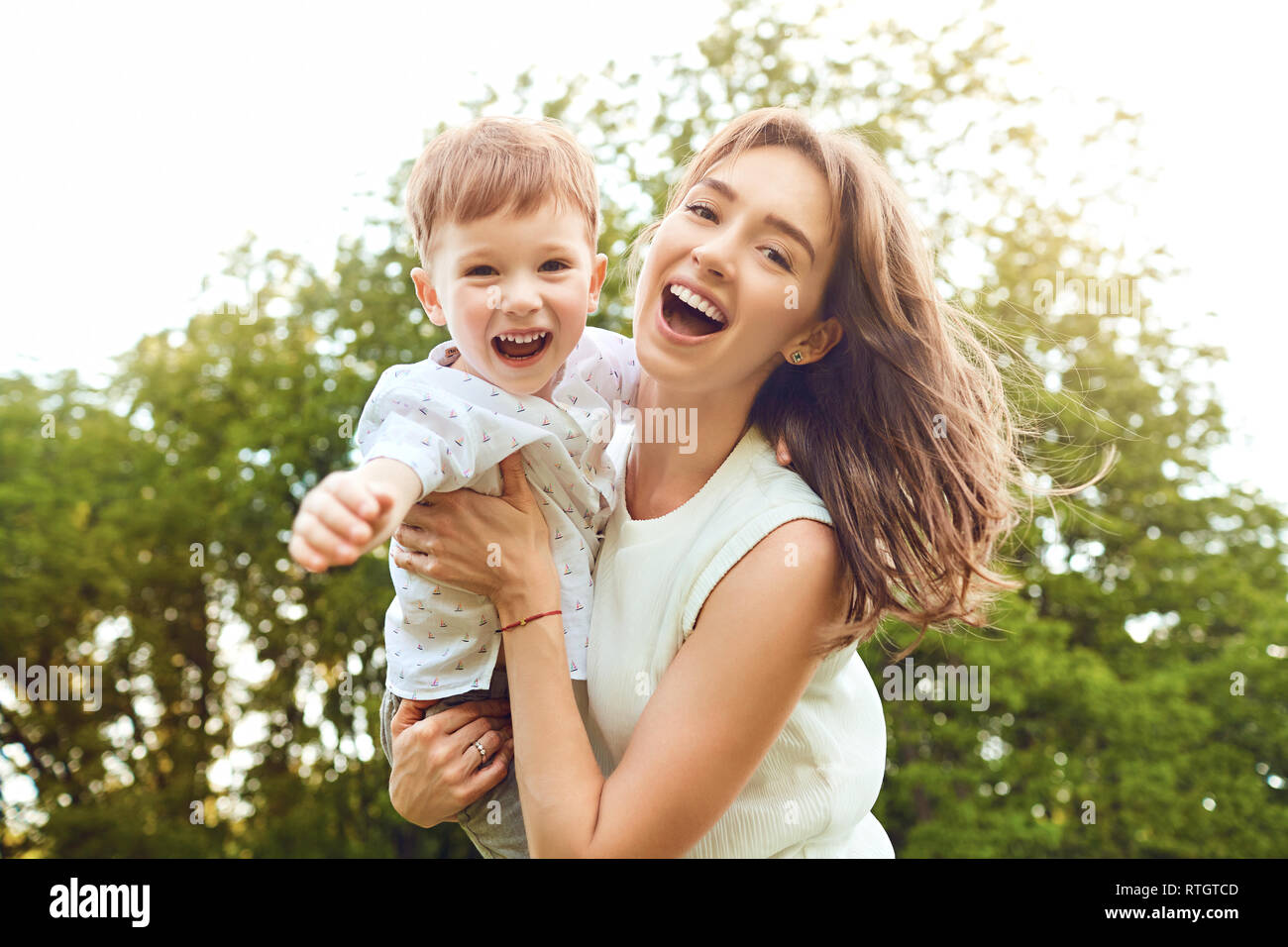 Mother and son are having fun in the park Stock Photo - Alamy