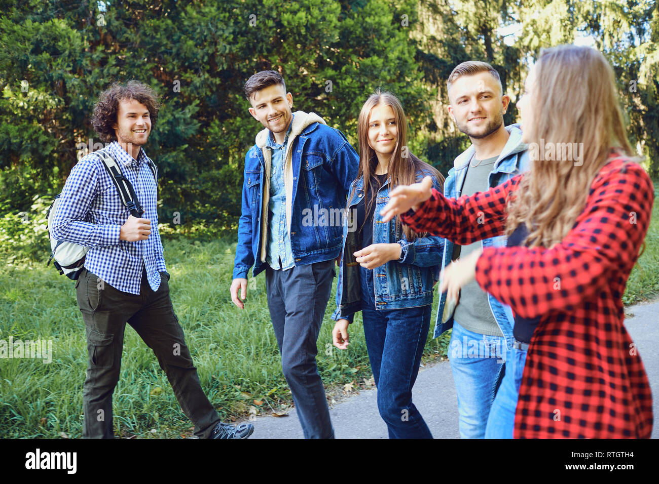 Happy friends walking are laughing at the park Stock Photo - Alamy