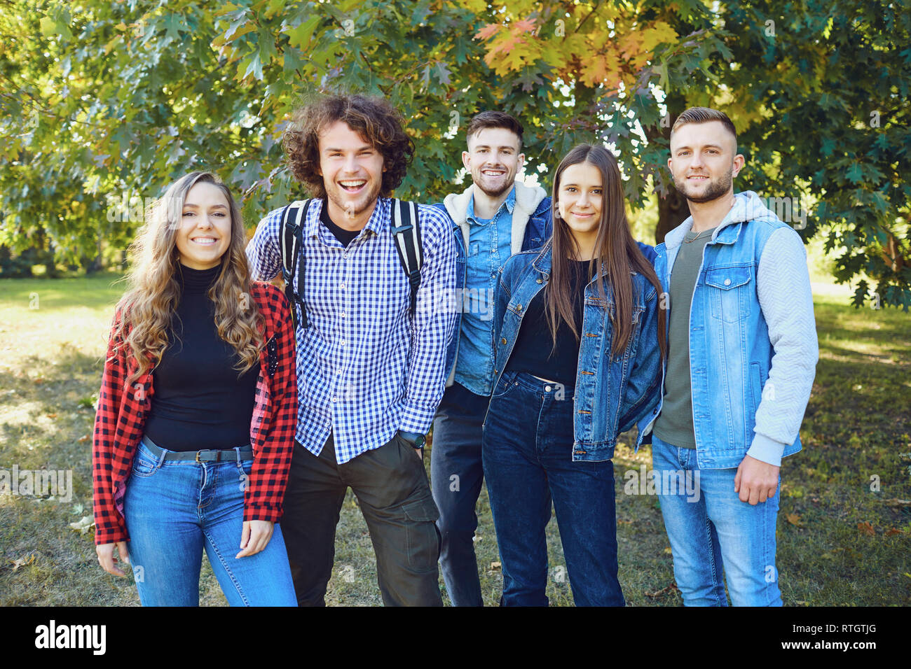 Group walking in park autumn hi-res stock photography and images - Alamy