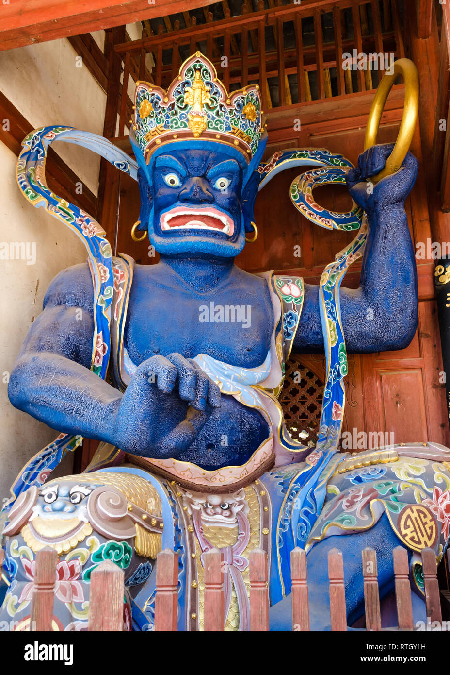 Statue at the entrance of Xingjiao temple in Sideng square, Shaxi ...