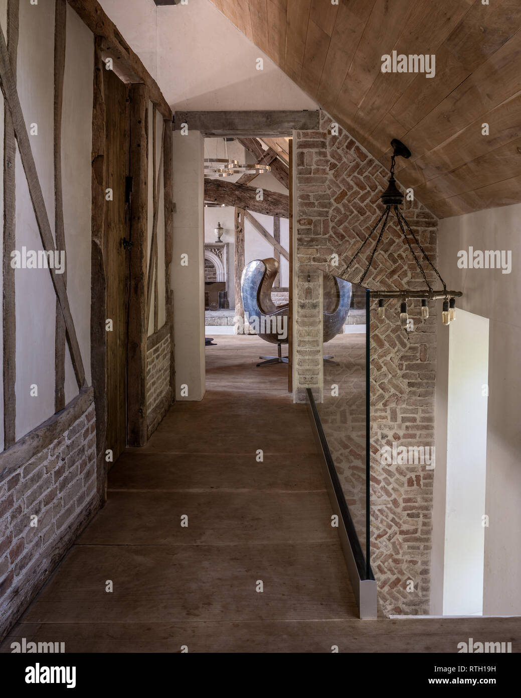 Medieval brickwork and oak beams with glass balustrade Stock Photo - Alamy