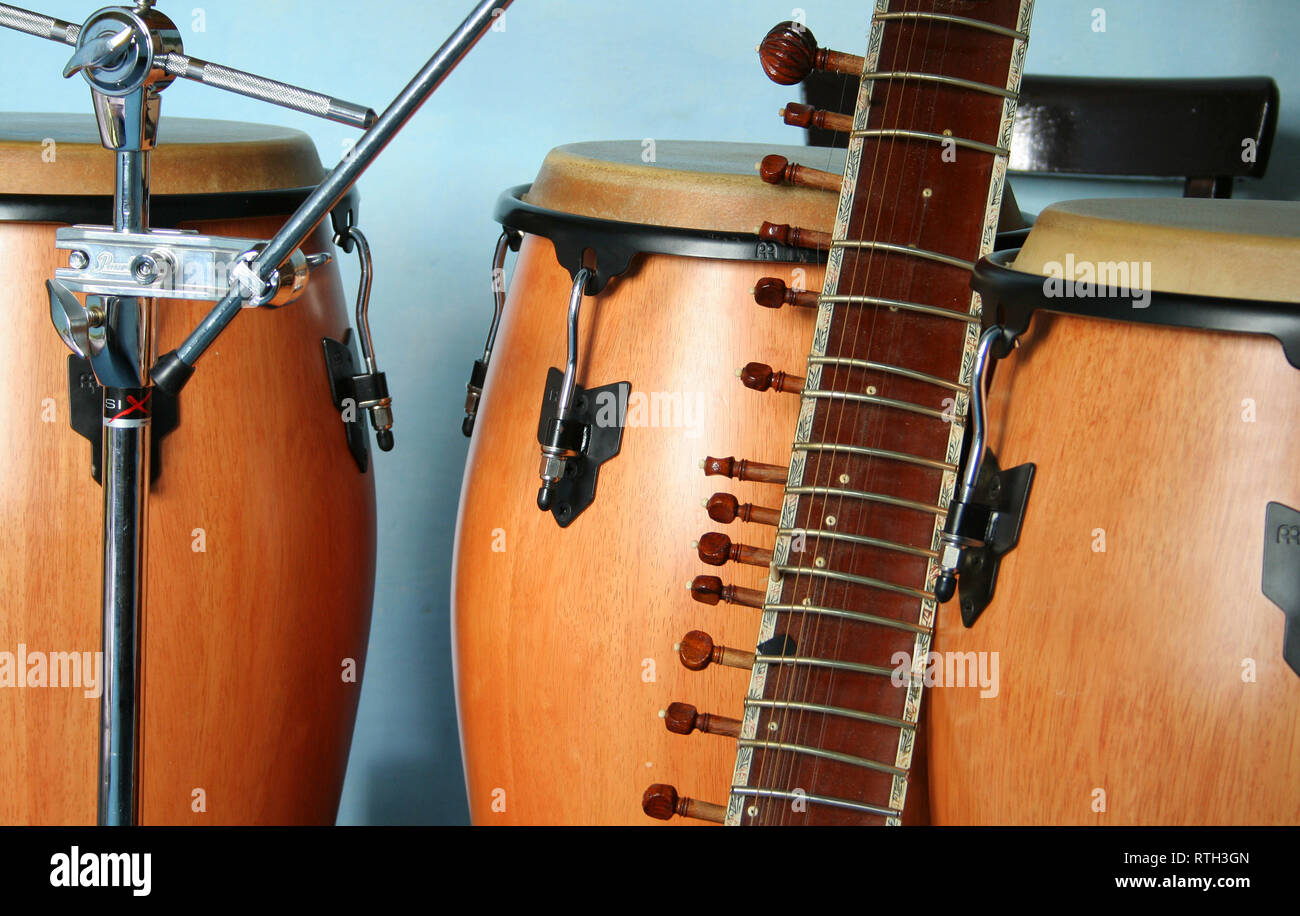 old sitar and three bongos Stock Photo - Alamy