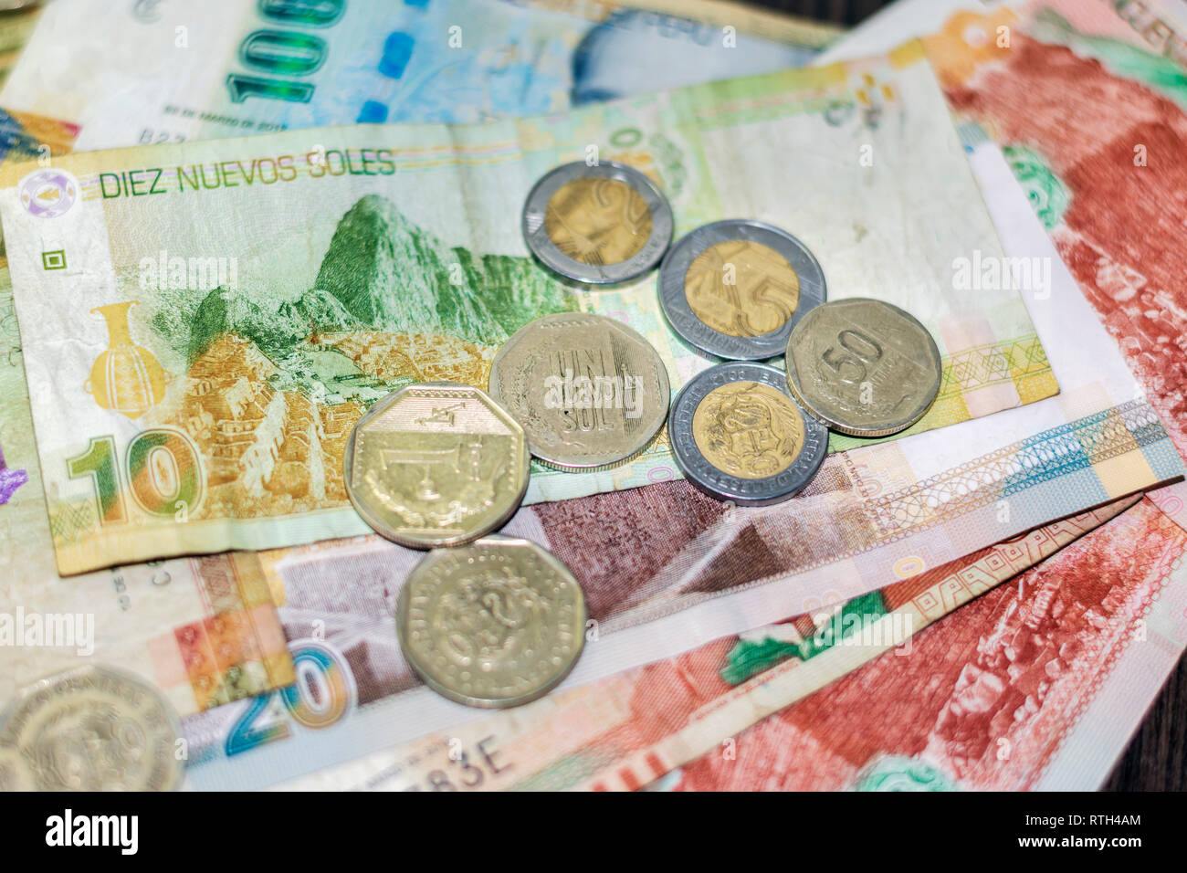 different Peruvian currency with focus on central coins Stock Photo - Alamy