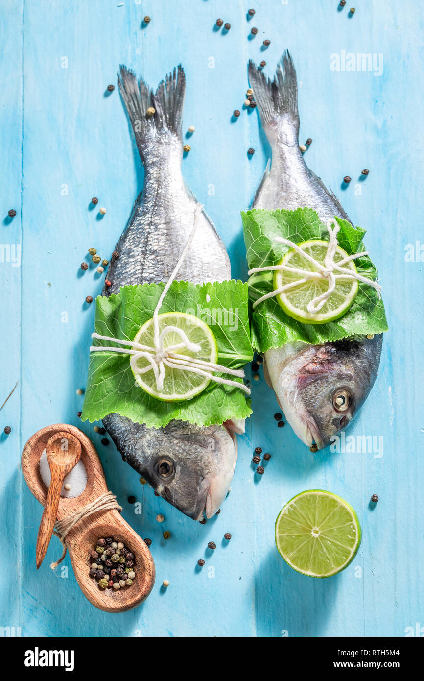 Top view of sea bream with salt and pepper Stock Photo - Alamy