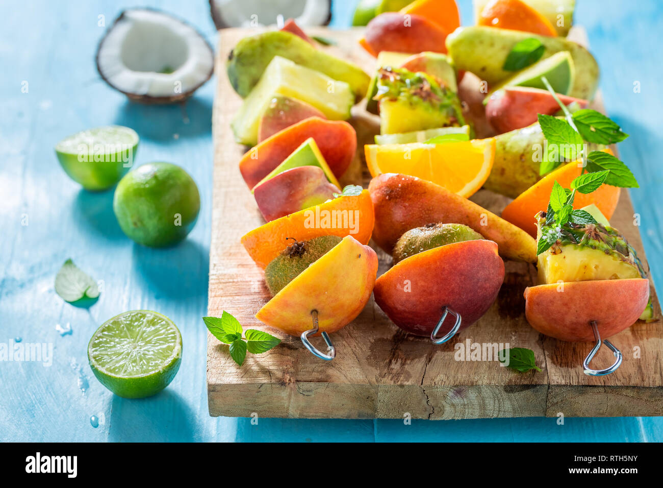 Sweet skewers with mix of fruits for snack Stock Photo - Alamy