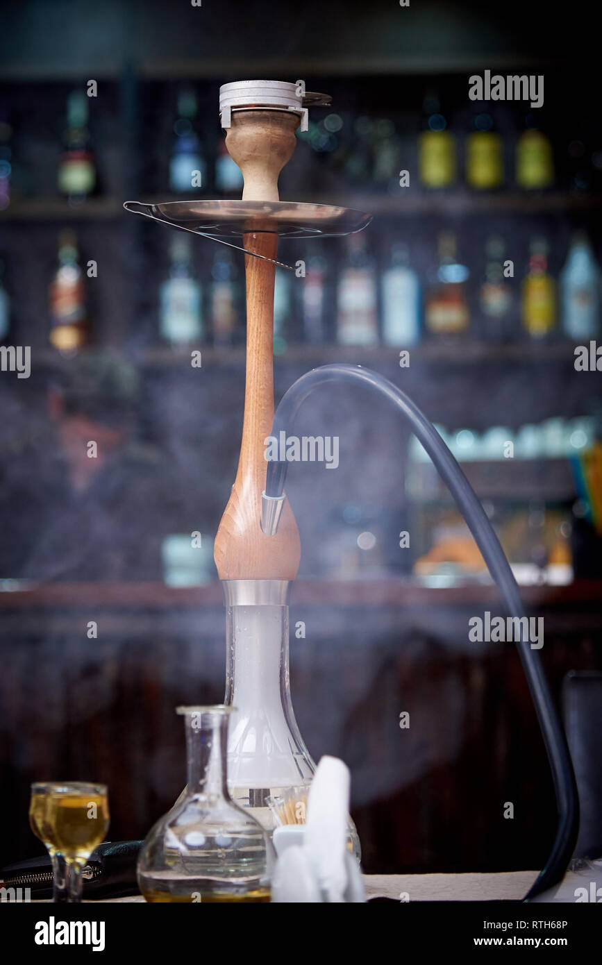 Hookah on a blurred background of the bar in the restaurant Stock Photo ...