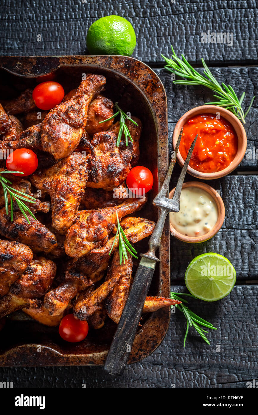 Top view of roasted chicken wings with different sauces Stock Photo - Alamy