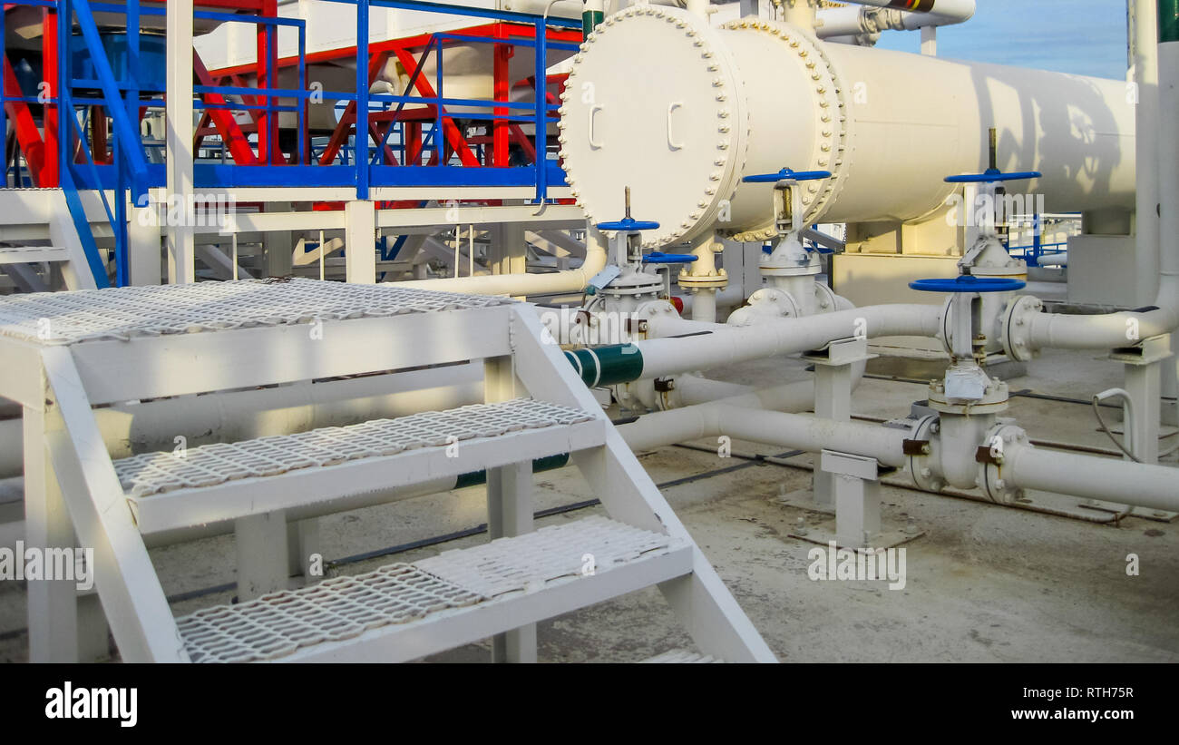 Heat exchangers in a refinery. The equipment for oil refining. Heated ...