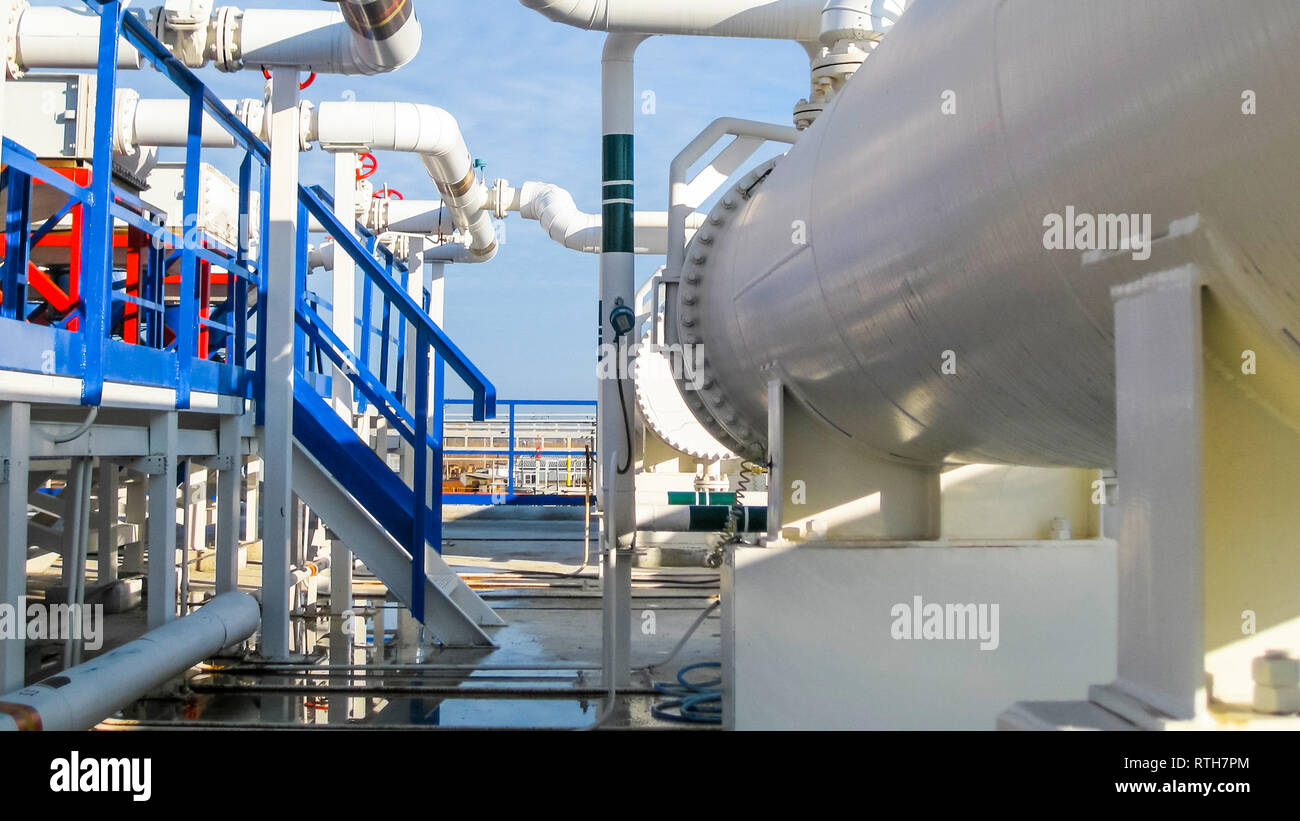 Heat exchangers in a refinery. The equipment for oil refining. Heated ...