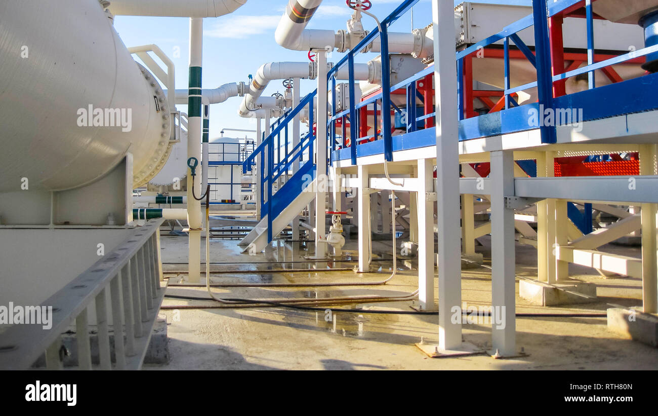 Heat exchangers in a refinery. The equipment for oil refining. Heated ...