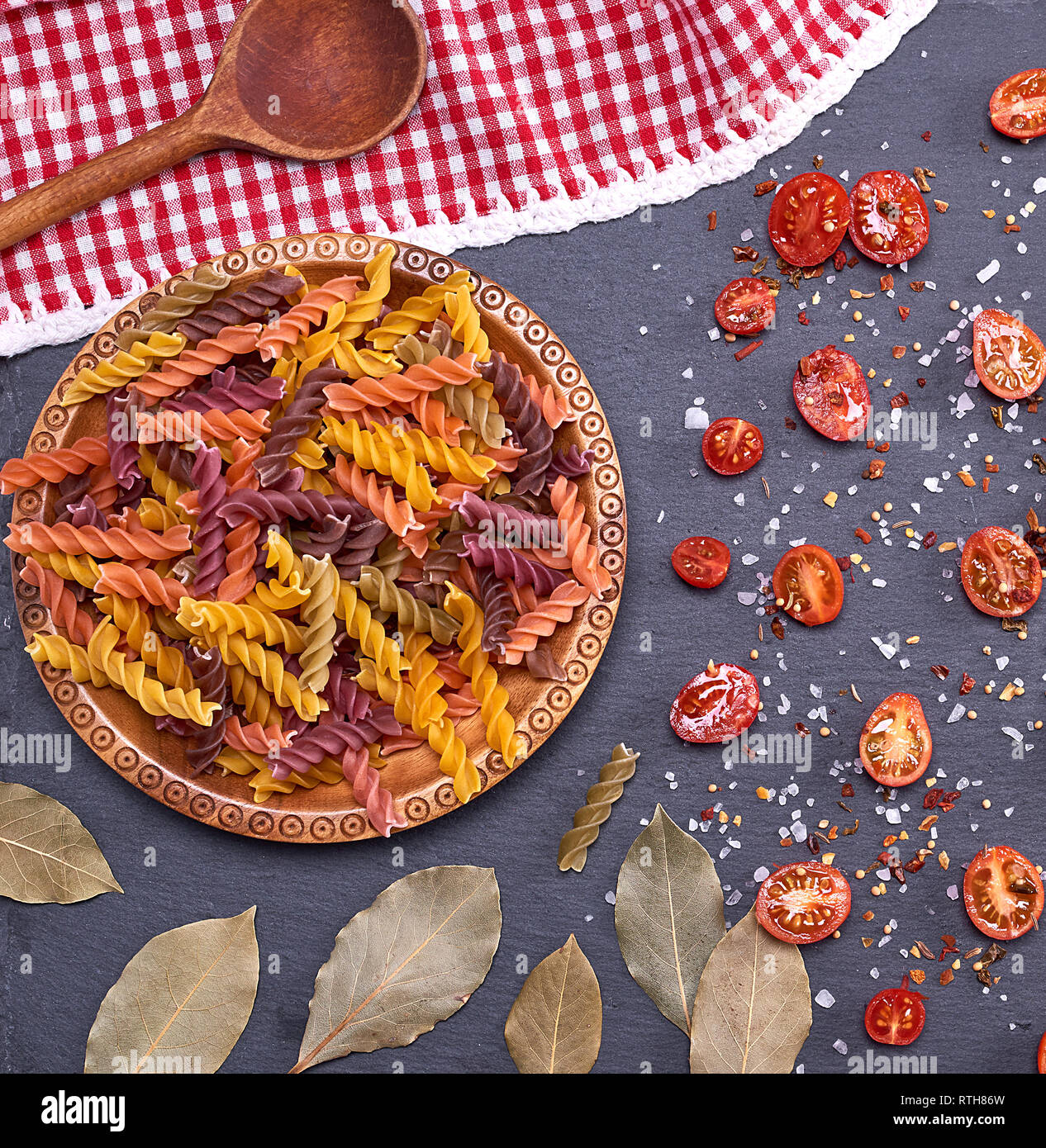 unprepared multi-colored pasta spiral made from wheat flour Stock Photo ...