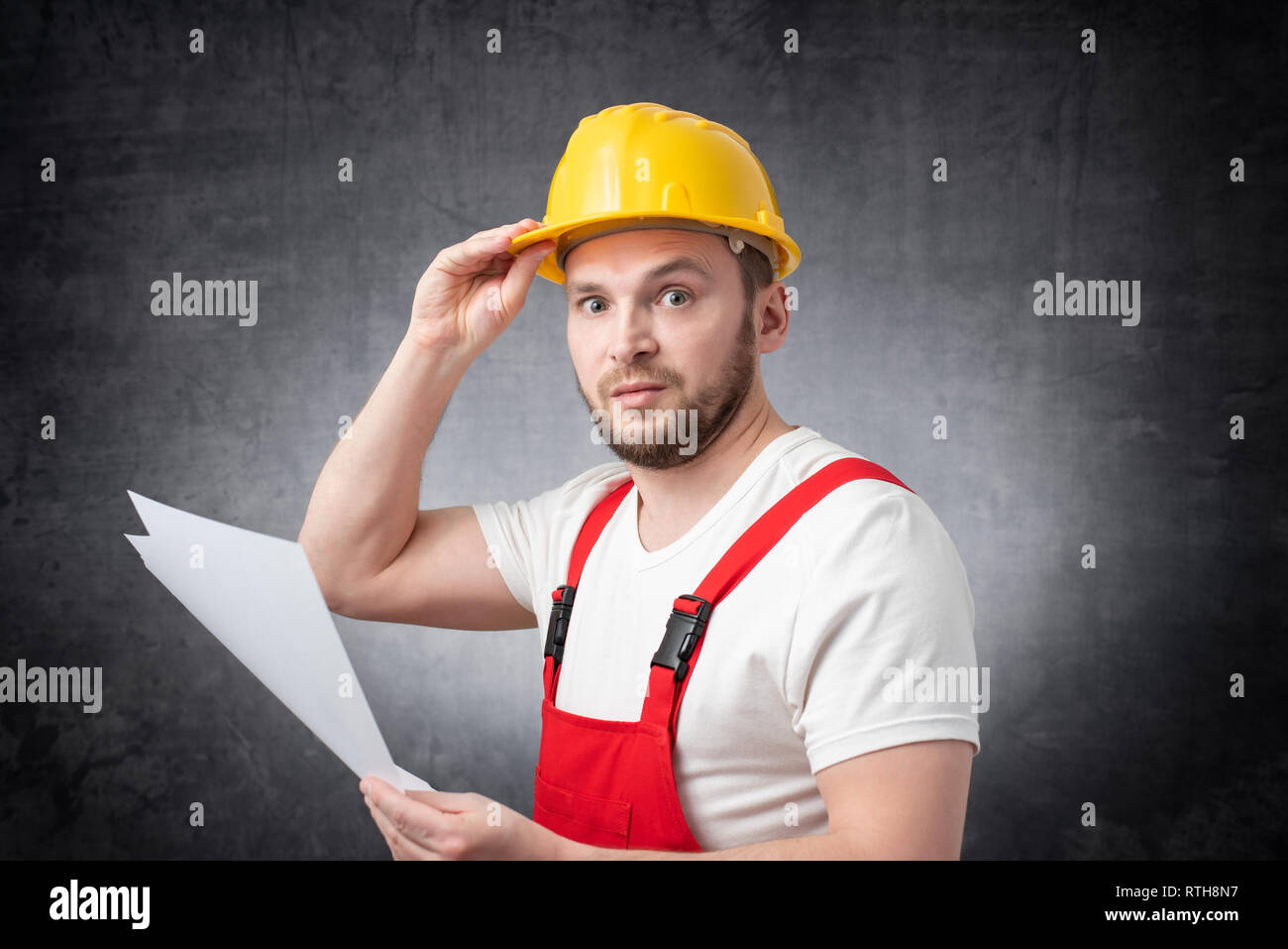 Confused puzzled construction builder worker hi-res stock photography ...