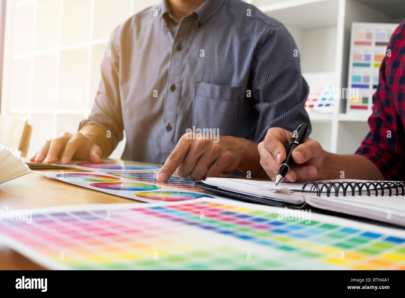 Graphic designers choose colors from the color bands samples for design ...