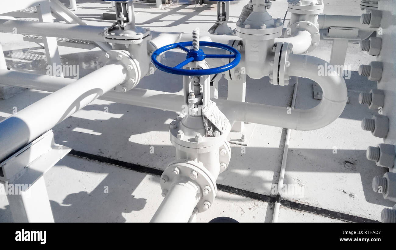 Latch on the pipeline. Oil refinery. Equipment for primary oil refining ...