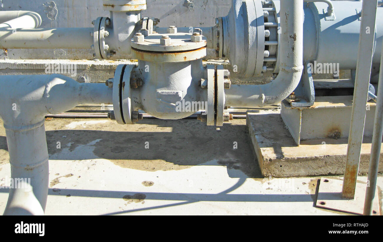 Latch on the pipeline. Oil refinery. Equipment for primary oil refining ...