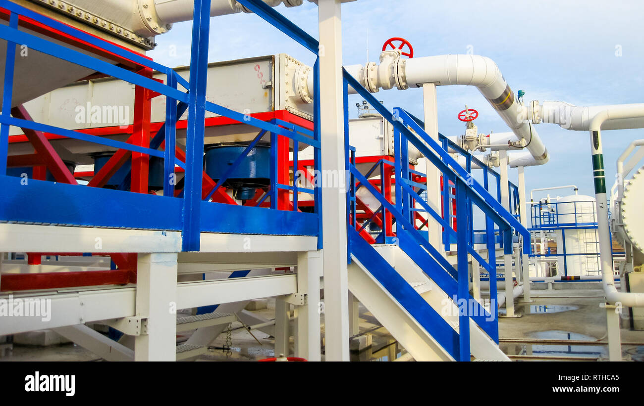 Pipes over Gasoline air coolers. Oil refinery. Equipment for primary ...