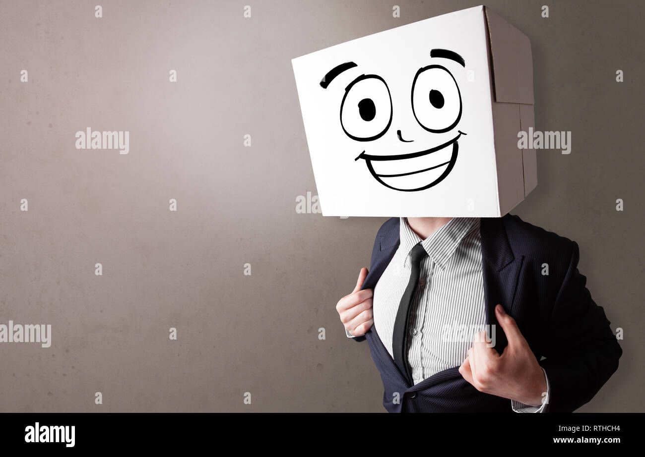 Young boy standing and gesturing with a cardboard box on his head Stock ...