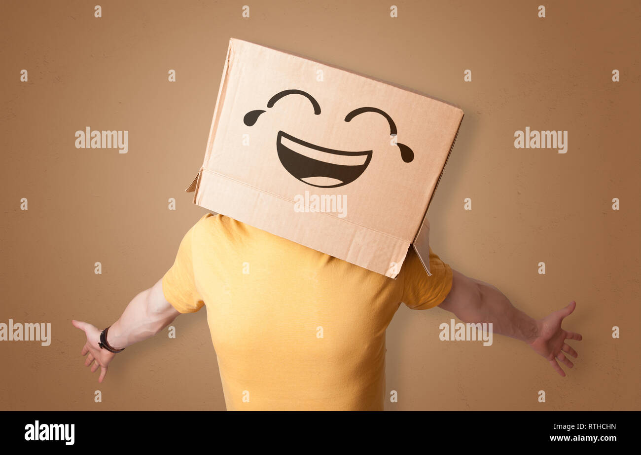 Funny man wearing cardboard box on his head with smiley face Stock ...