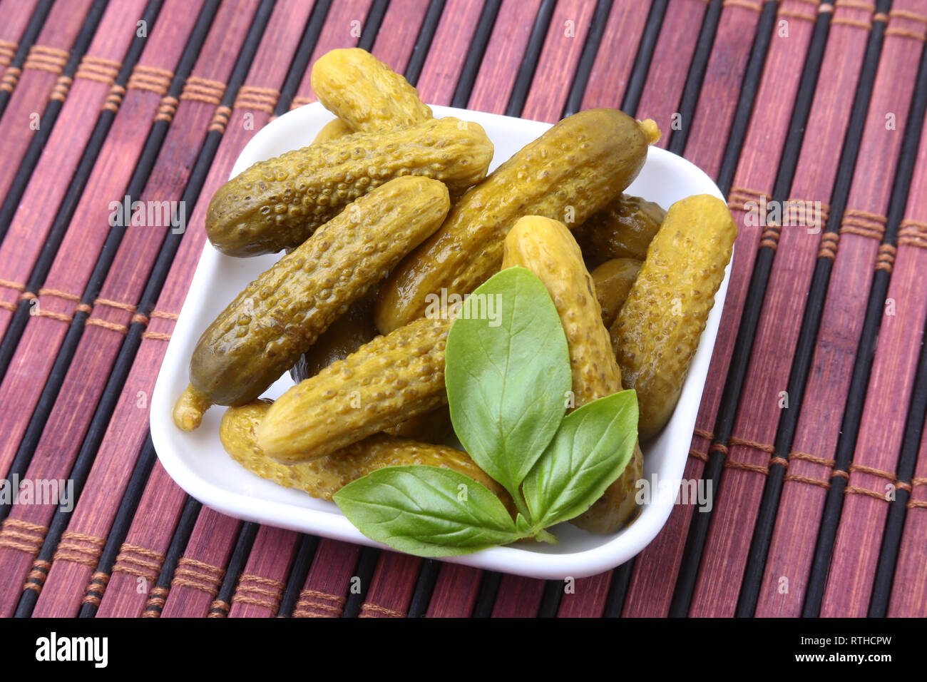 Pickles. Bowl of pickled gherkins cucumber with copy space. Cornichons ...
