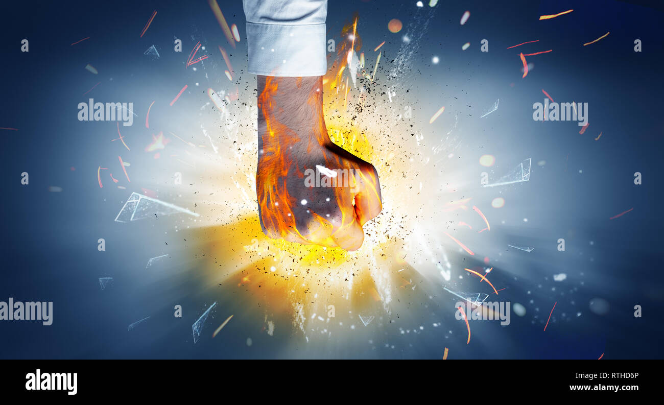 Hand hits strongly and makes fire beam around Stock Photo - Alamy