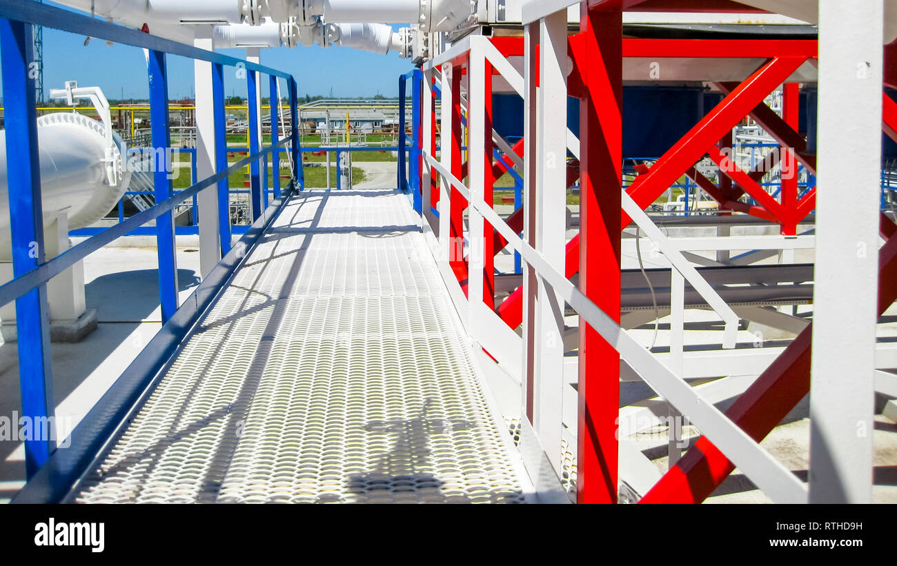 Steel service platform and stairs. Equipment refinery Stock Photo - Alamy