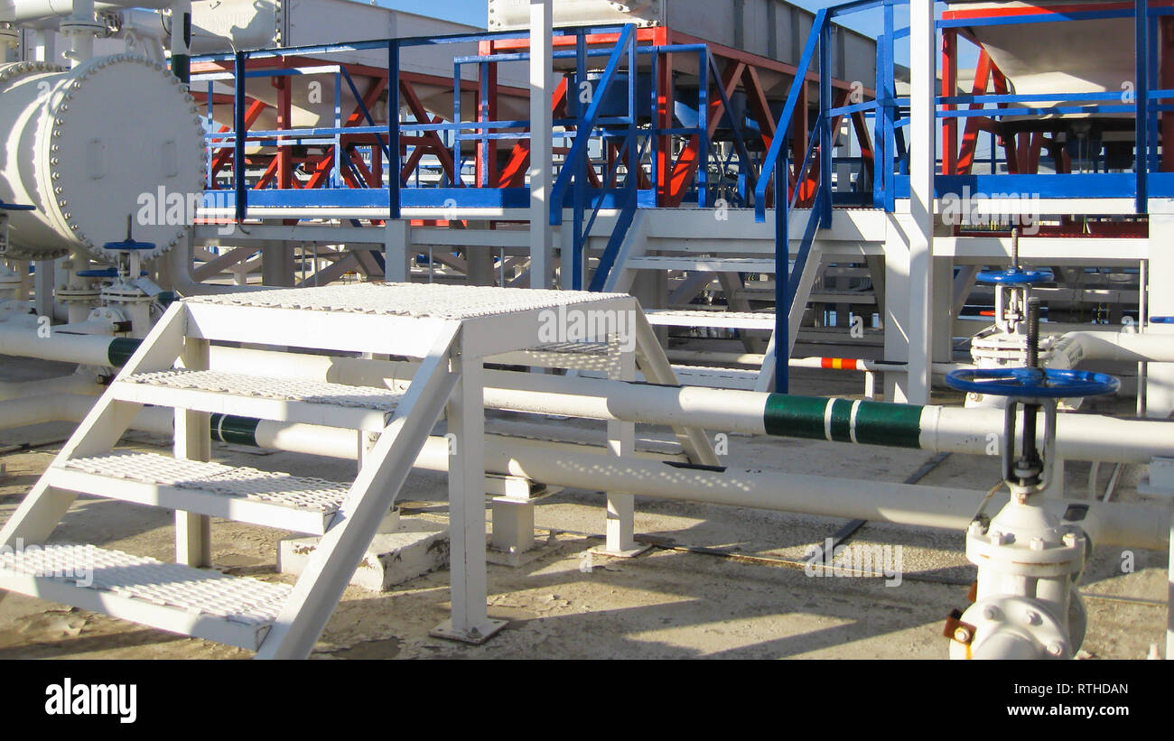 Steel service platform and stairs. Equipment refinery Stock Photo - Alamy