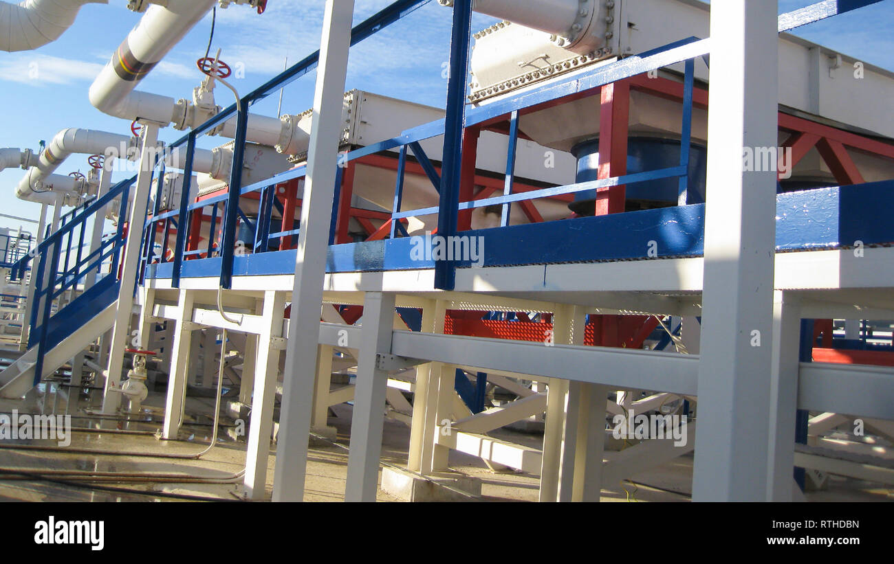 Steel service platform and stairs. Equipment refinery Stock Photo - Alamy